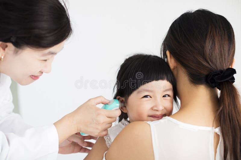 Doctor Taking Temperature Using in Ear Thermometer Stock Photo - Image ...