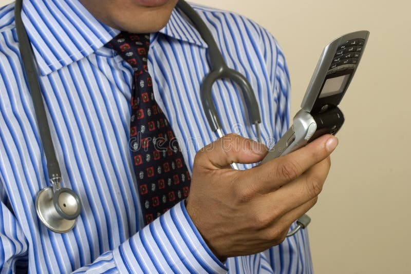 Doctor taking urgent call stock image. Image of help - 14688547