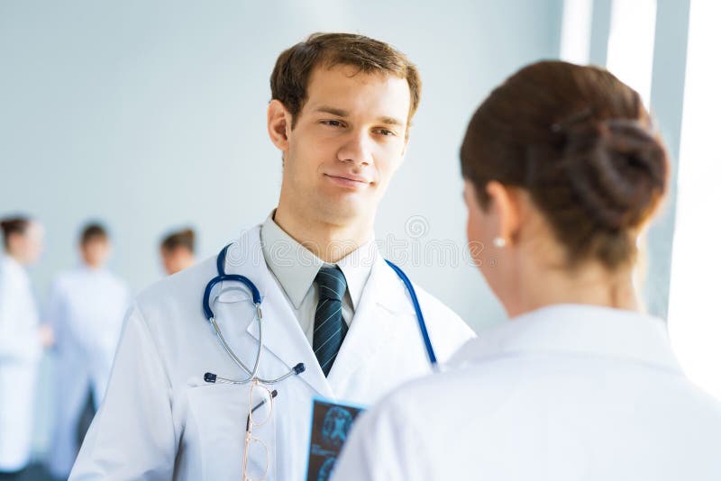 Doctor Talking with a Colleague Stock Image - Image of medical, discuss ...