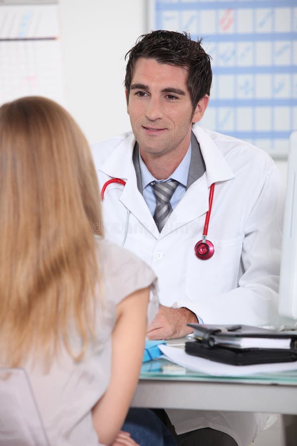 Doctor Talking with Female Patient. Stock Photo - Image of doctor ...