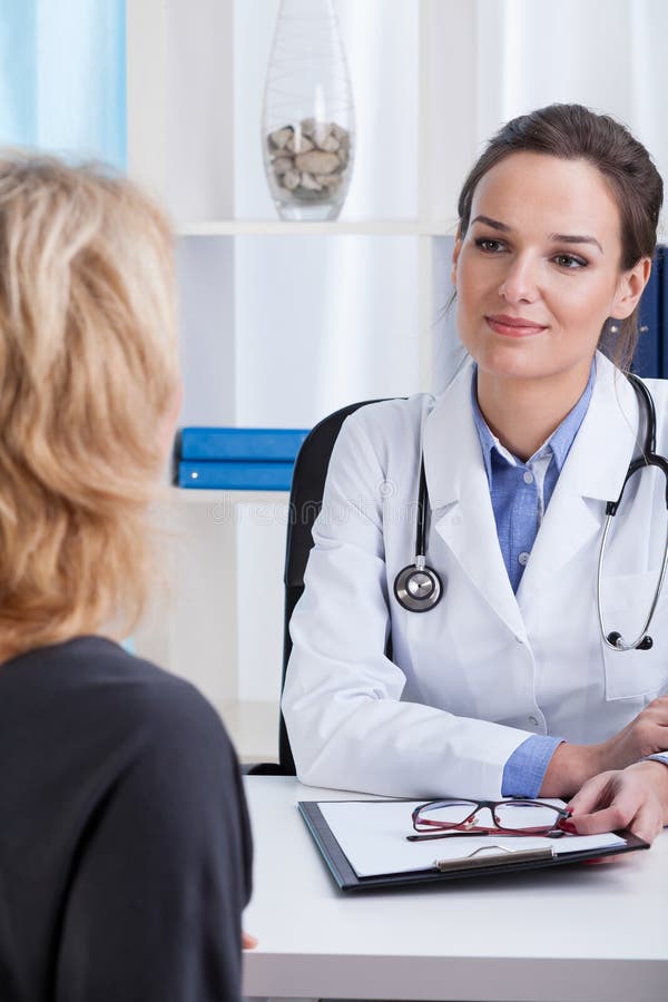 Doctor Talking with Patient in the Office and Stock Image - Image of ...