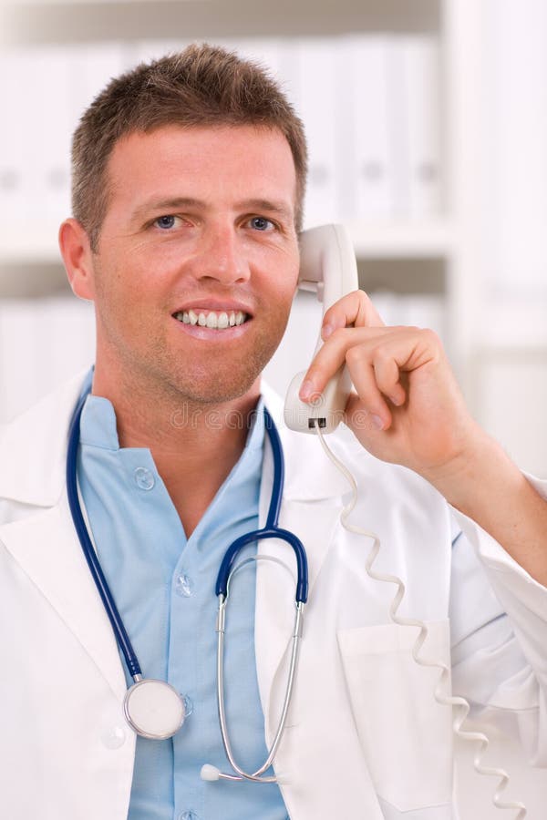 Doctor talking on phone stock photo. Image of disease - 7628646