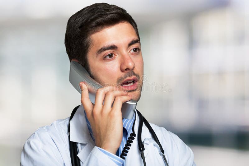 Doctor Talking on the Phone Stock Photo - Image of phone, doctor: 42983274