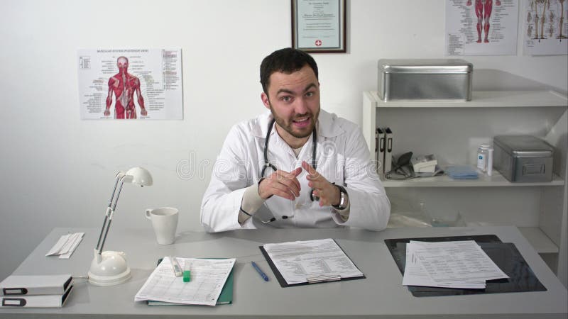 Doctor Talking To Camera, Smiling and Showing Thumbs Up Stock Image ...