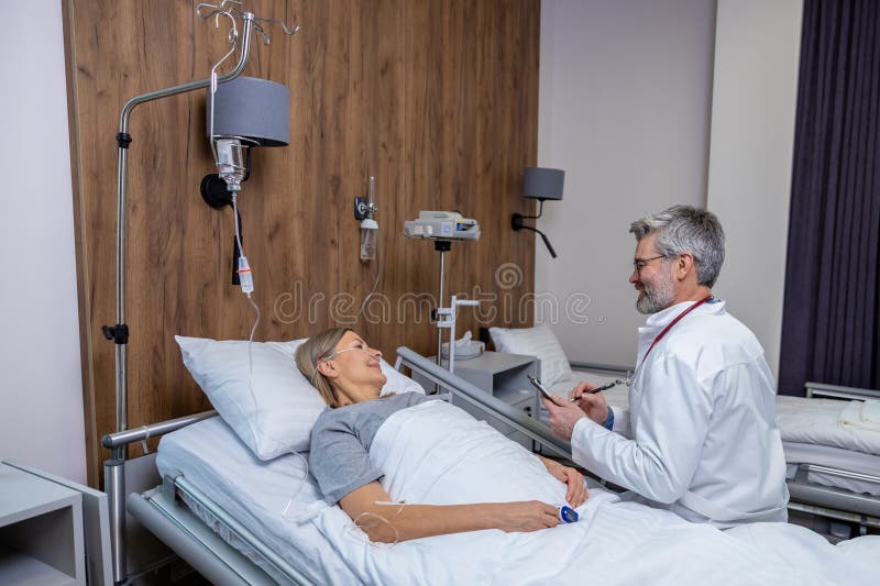 Doctor Talking To a Patient in Clinic and Looking Involved and ...