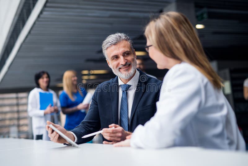 Doctor Talking To a Pharmaceutical Sales Representative. Stock Photo ...