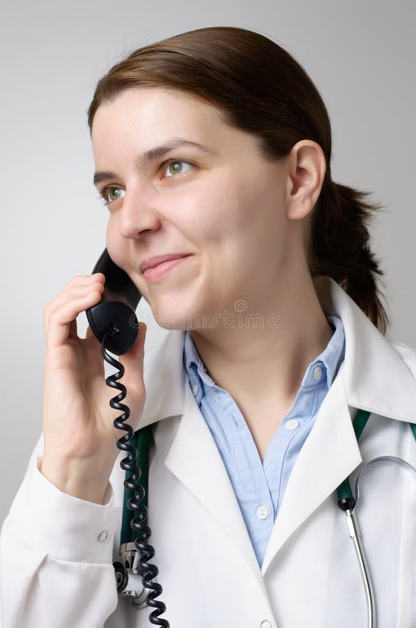 Doctor with telephone stock image. Image of medical, female - 40551449
