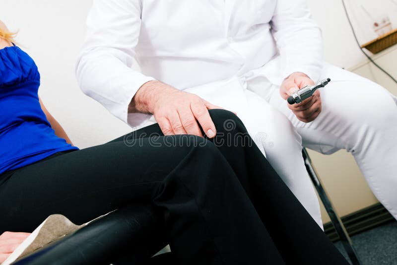 Doctor testing reflexes stock image. Image of test, reflexes - 6763161