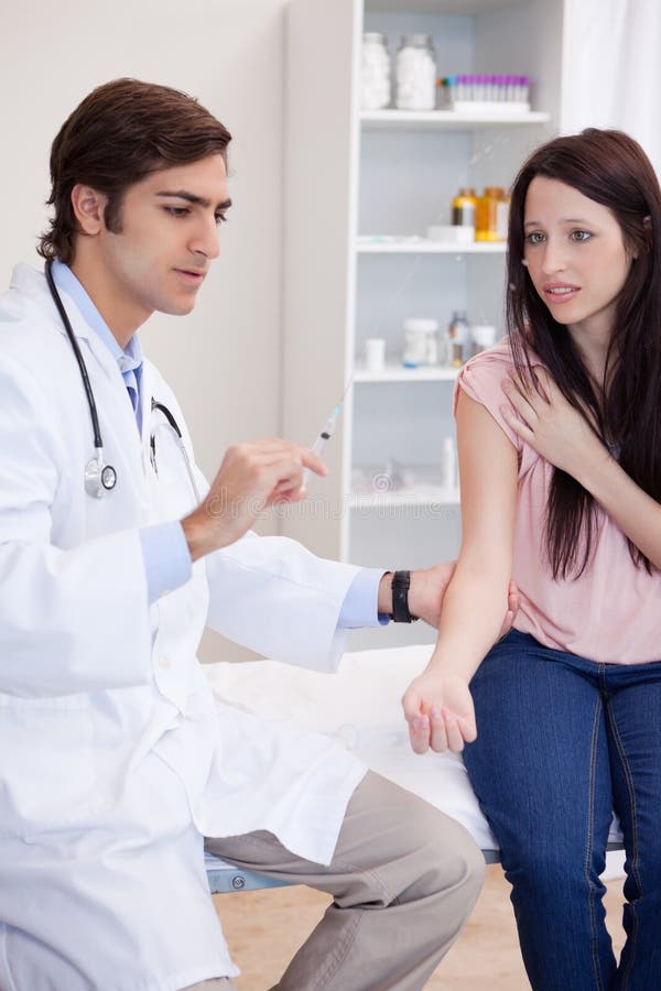 Doctor about To Give an Injection To Patient Stock Image - Image of ...
