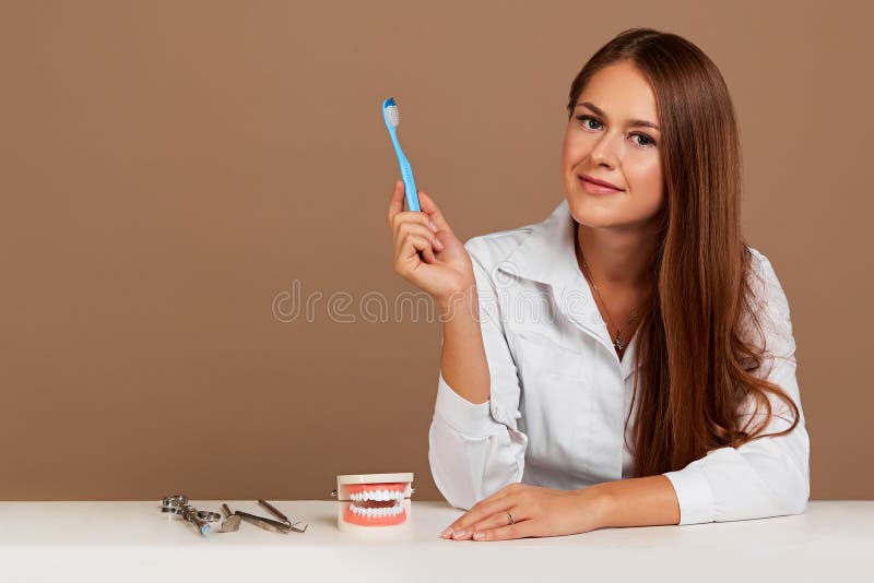 The Doctor on the Toothbrush Squeezing the Toothpaste Concept Design ...