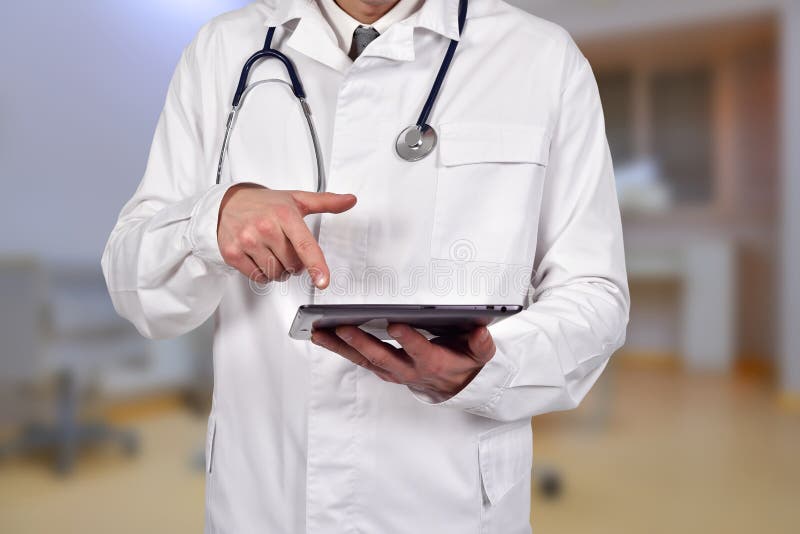 Doctor with touch pad stock image. Image of physician - 35528703