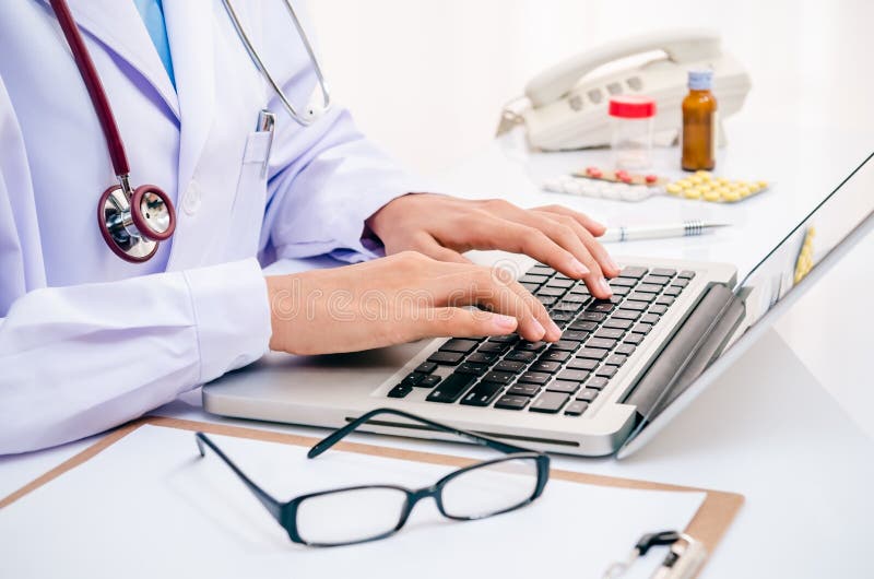 Doctor typing on computer stock photo. Image of hands - 55462602