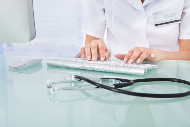 Doctor Typing on Computer Keyboard in Clinic Stock Image - Image of ...