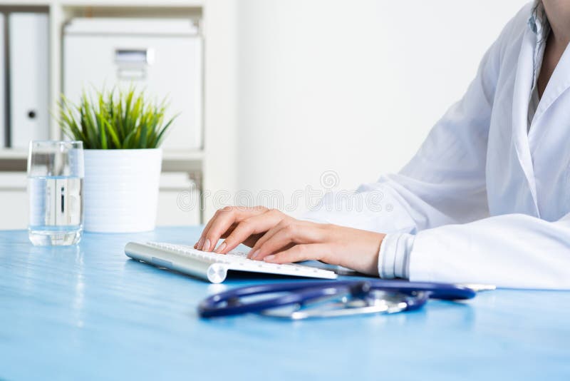 Doctor Typing at Computer Keyboard Stock Photo - Image of doctor ...