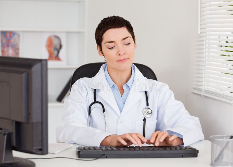 Doctor Typing with Her Computer Stock Photo - Image of healthcare ...