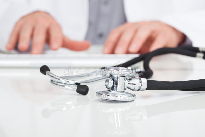 Doctor typing on keyboard stock photo. Image of object - 40194754