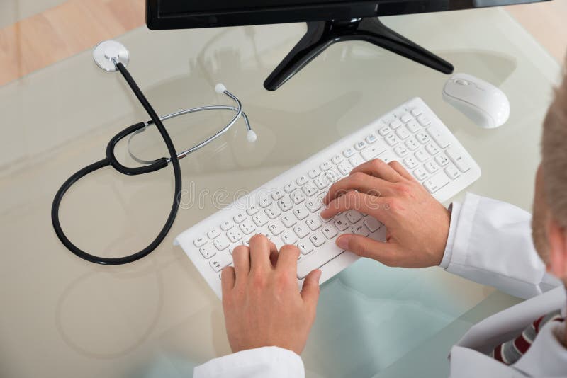Doctor Typing On Keyboard stock image. Image of person - 56527971