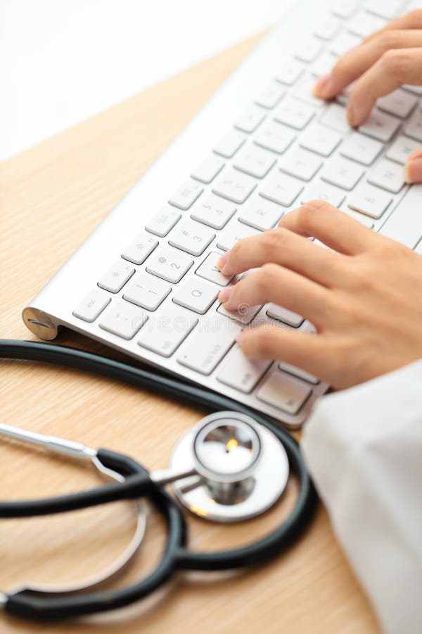Doctor typing on keyboard stock photo. Image of professional - 31118552