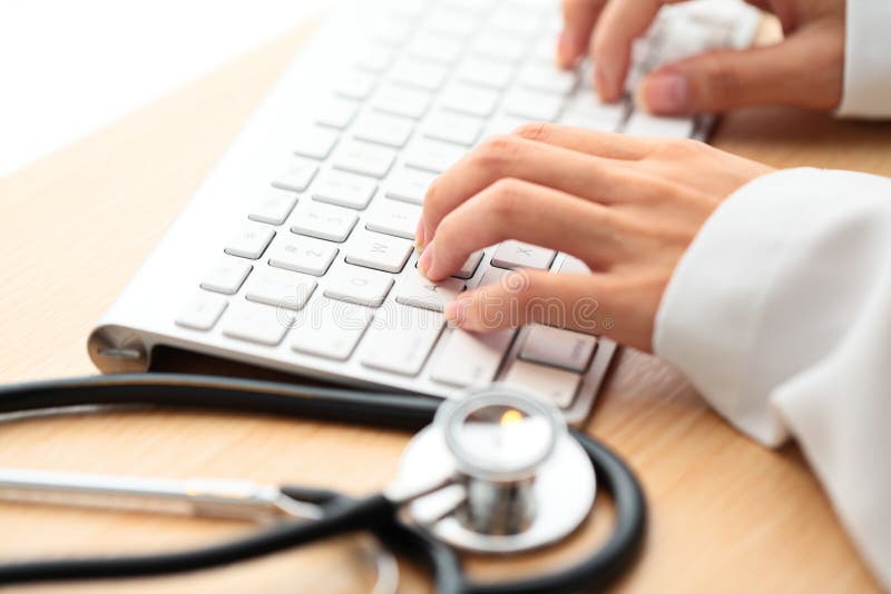 Doctor Typing in Keyboard with Stethoscope Stock Photo - Image of exam ...