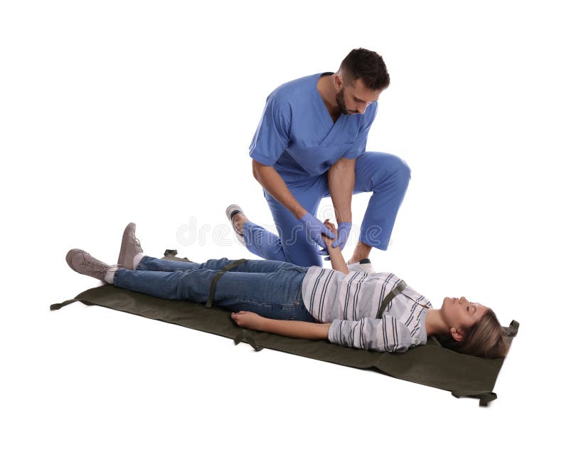 Doctor in Uniform Fixing Woman on Stretcher Stock Photo - Image of ...