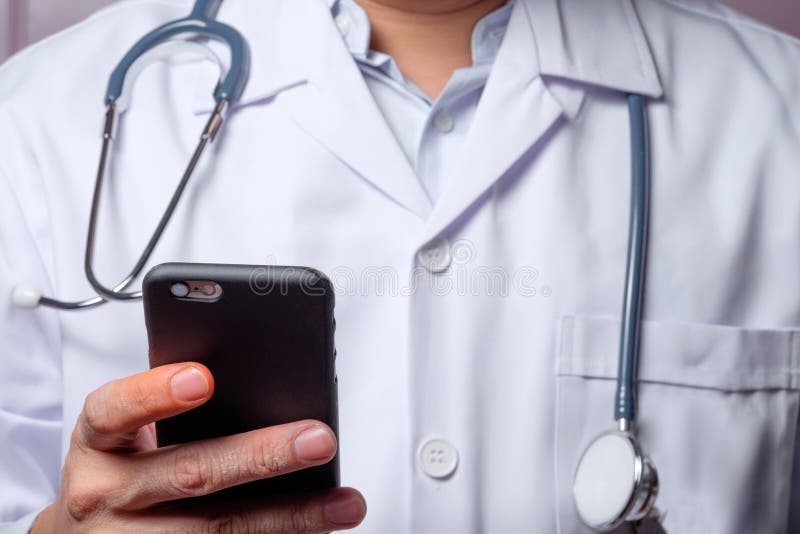 Doctor use mobile phone stock image. Image of student - 57786735