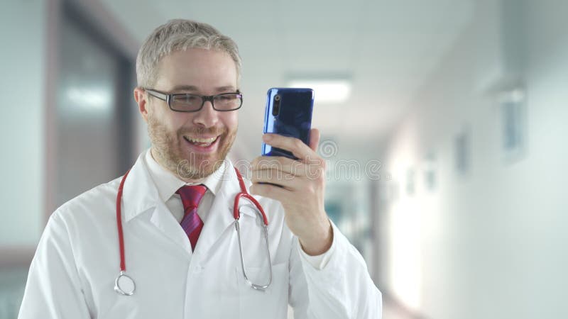 Doctor Uses His Phone for a Video Call from a Patient Stock Image ...