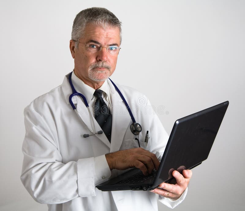Doctor using computer stock photo. Image of glasses, smiling - 2399934