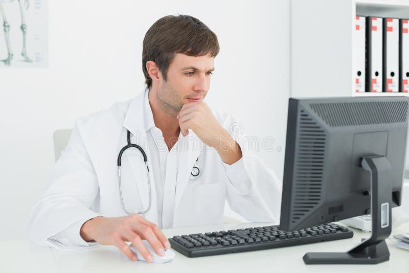 Doctor Using Computer at Medical Office Stock Image - Image of office ... Doctor Using Computer at Medical Office Stock Image - Image of office ...