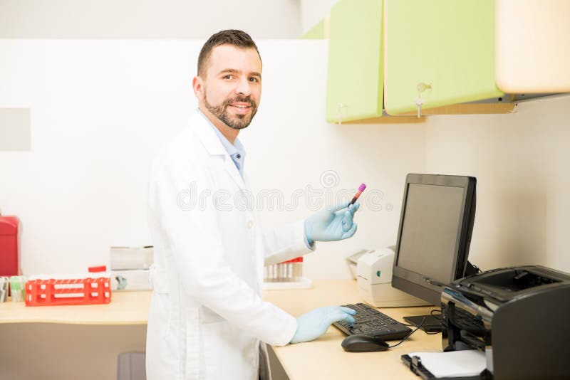 Doctor Using Computer To Record Blood Test Stock Image - Image of blood ...