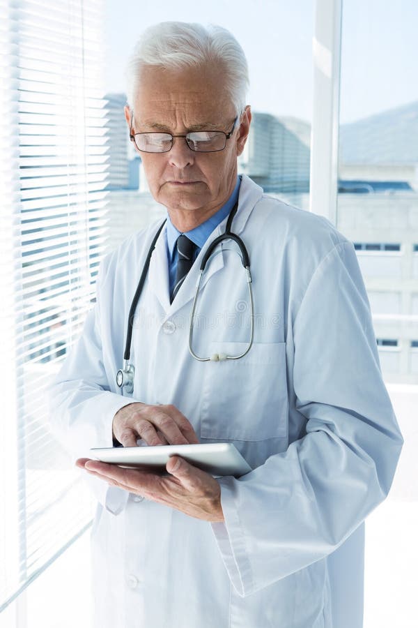 Doctor Using Digital Tablet Stock Image - Image of health, expertise ...