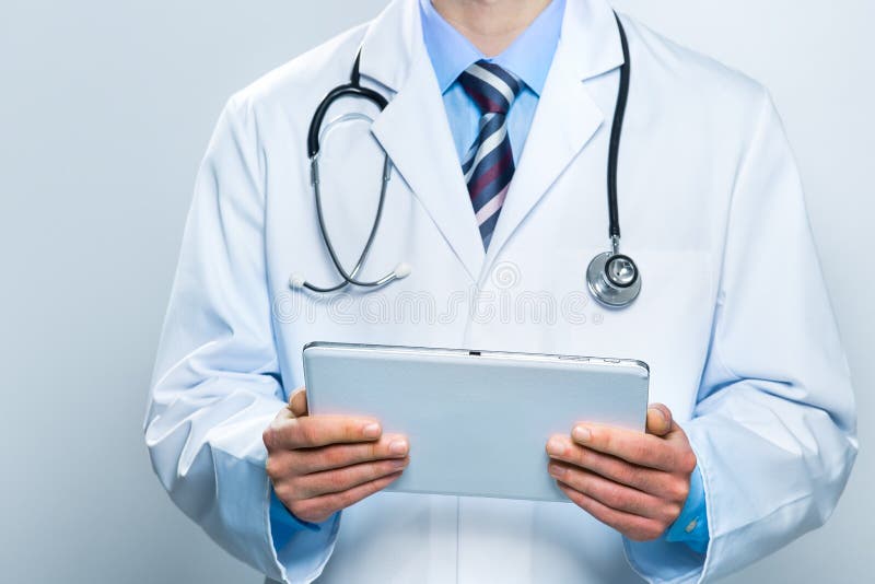 Doctor Using a Digital Tablet Stock Photo - Image of laptop, display ...