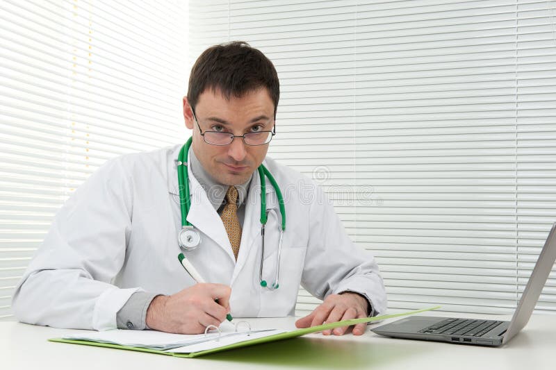 Doctor Using His Laptop Computer Stock Photo - Image of handsome, white ...