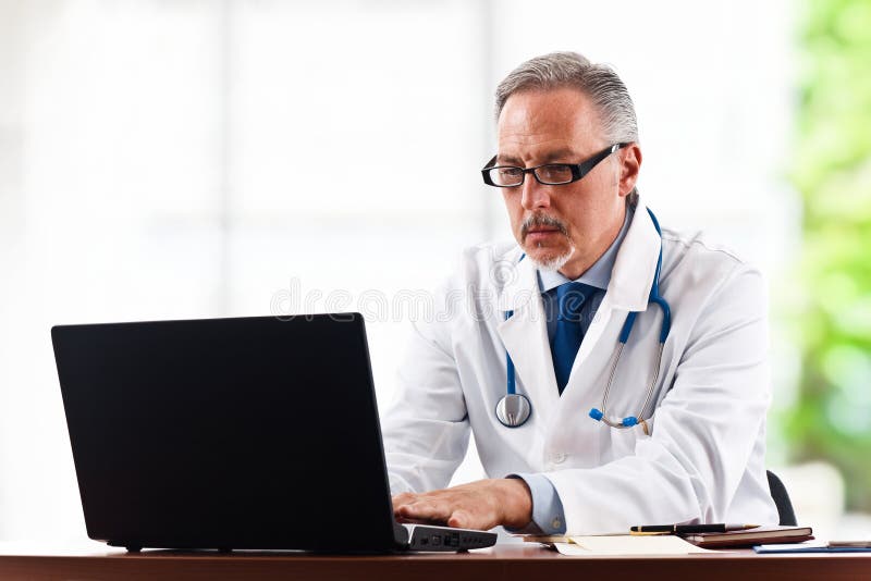 Doctor using a laptop stock photo. Image of medic, friendly - 22498966