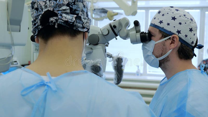 Doctor Using Microscope during Nerve Surgery. a Professional ...