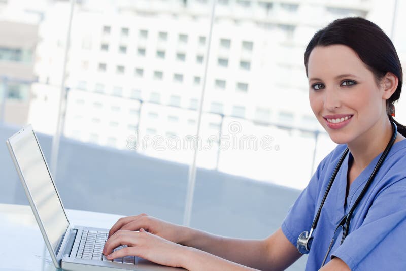 Doctor using a notebook stock photo. Image of notebook - 22692752