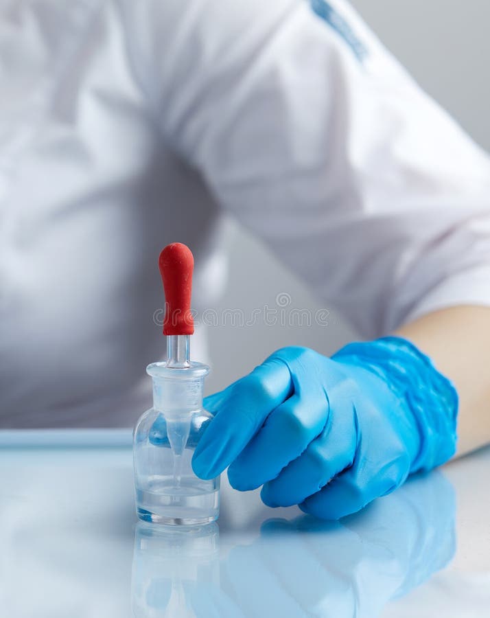 Doctor Using Pipette for Taking Samples for Test in Special Chemical ...