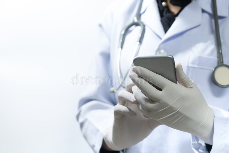 Doctor Using Smartphone with Patient in Hospital Interior Blur for ...