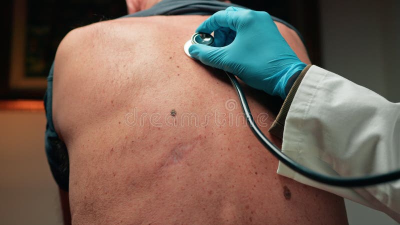 Doctor Using Stethoscope in the Back of a Patient for Lung Check Stock ...