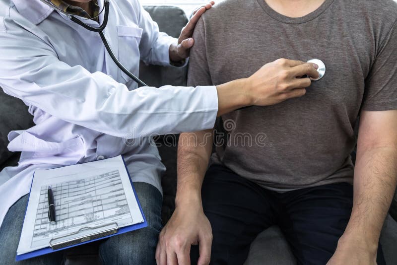 Doctor Using a Stethoscope Checking Patient about the Problem of ...