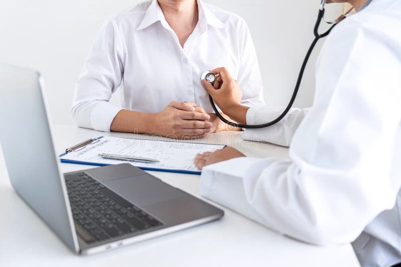 Doctor Using a Stethoscope Checking Patient about the Problem of ...