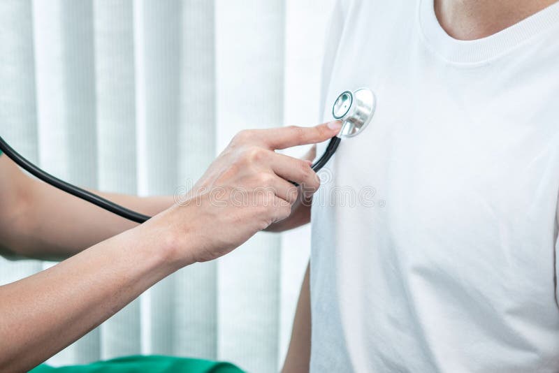 Doctor Using a Stethoscope Checking Patient about the Problem of ...