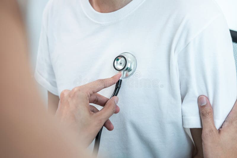 Doctor Using a Stethoscope Checking Patient about the Problem of ...