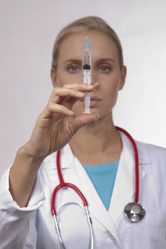 Doctor using a syringe stock photo. Image of doctor, beautiful - 12088962