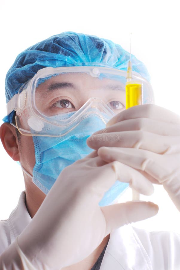 Doctor using a syringe stock photo. Image of biological - 8417298