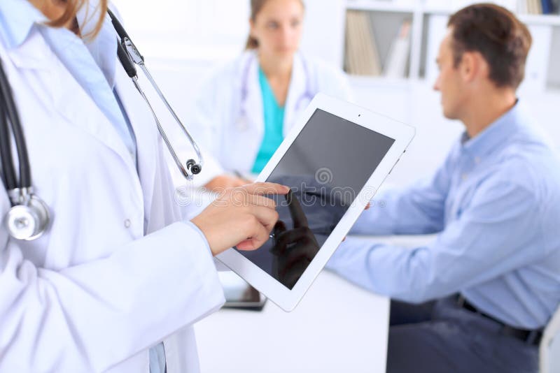 Doctor Using Tablet Computer, Close-up of Hands at Touch Pad Screen ...
