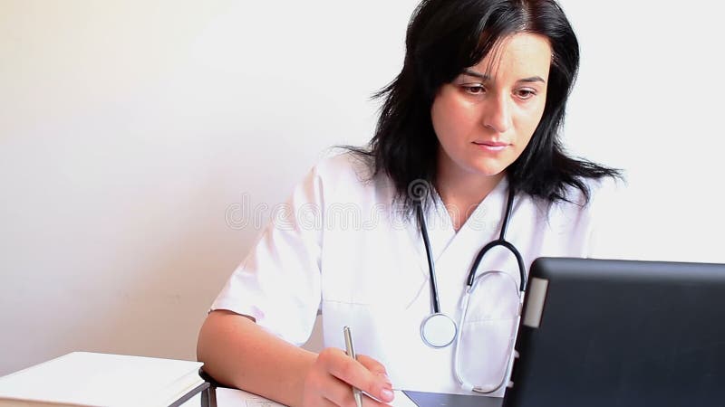 A Doctor Using a Touch Screen Interface To Analyze Medical Data ...