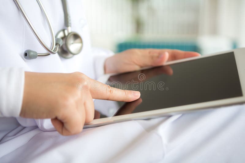 Doctor Using Tablet Computer Stock Photo - Image of clinic, specialist ...