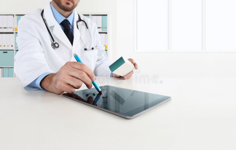 Doctor Using Tablet on Desk Office Prescribes the Medicine Stock Photo ...
