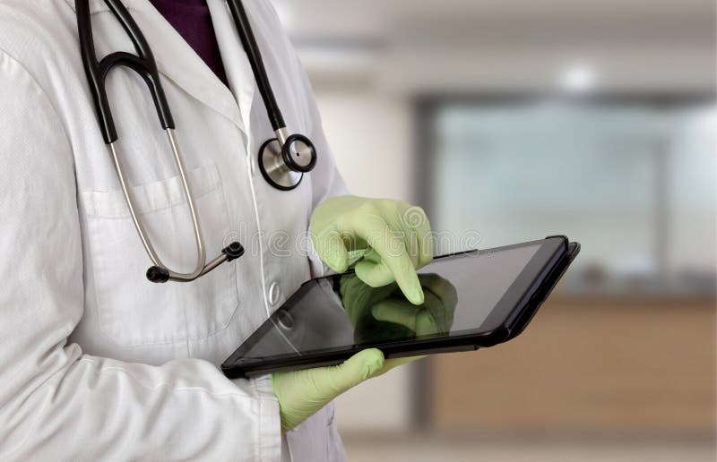 Doctor Using Tablet in Hospital Stock Image - Image of nurse, practice ...