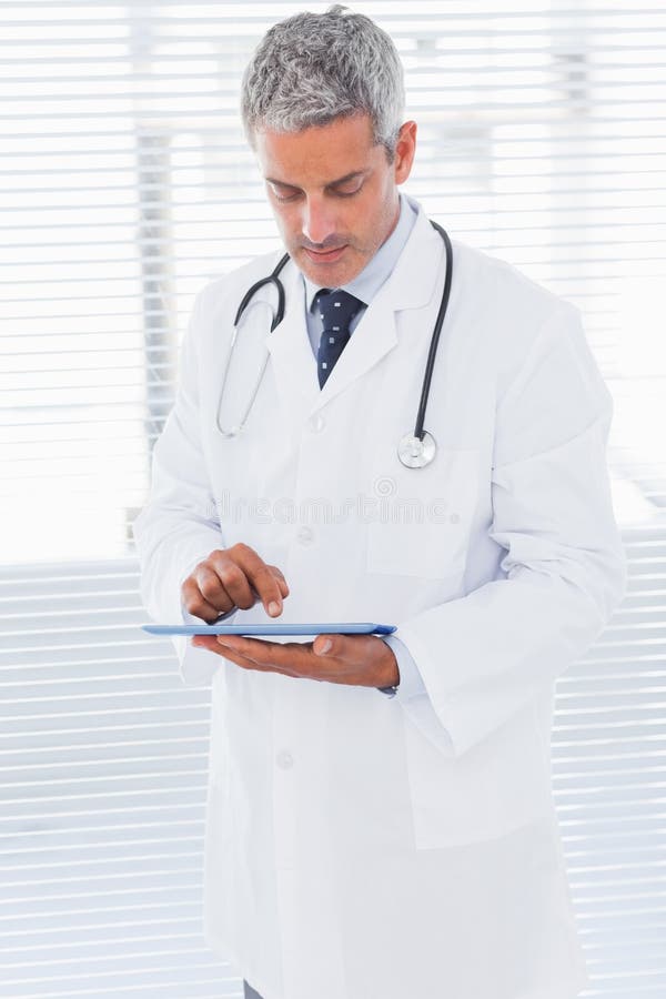 Doctor using tablet pc stock photo. Image of computer - 32513946